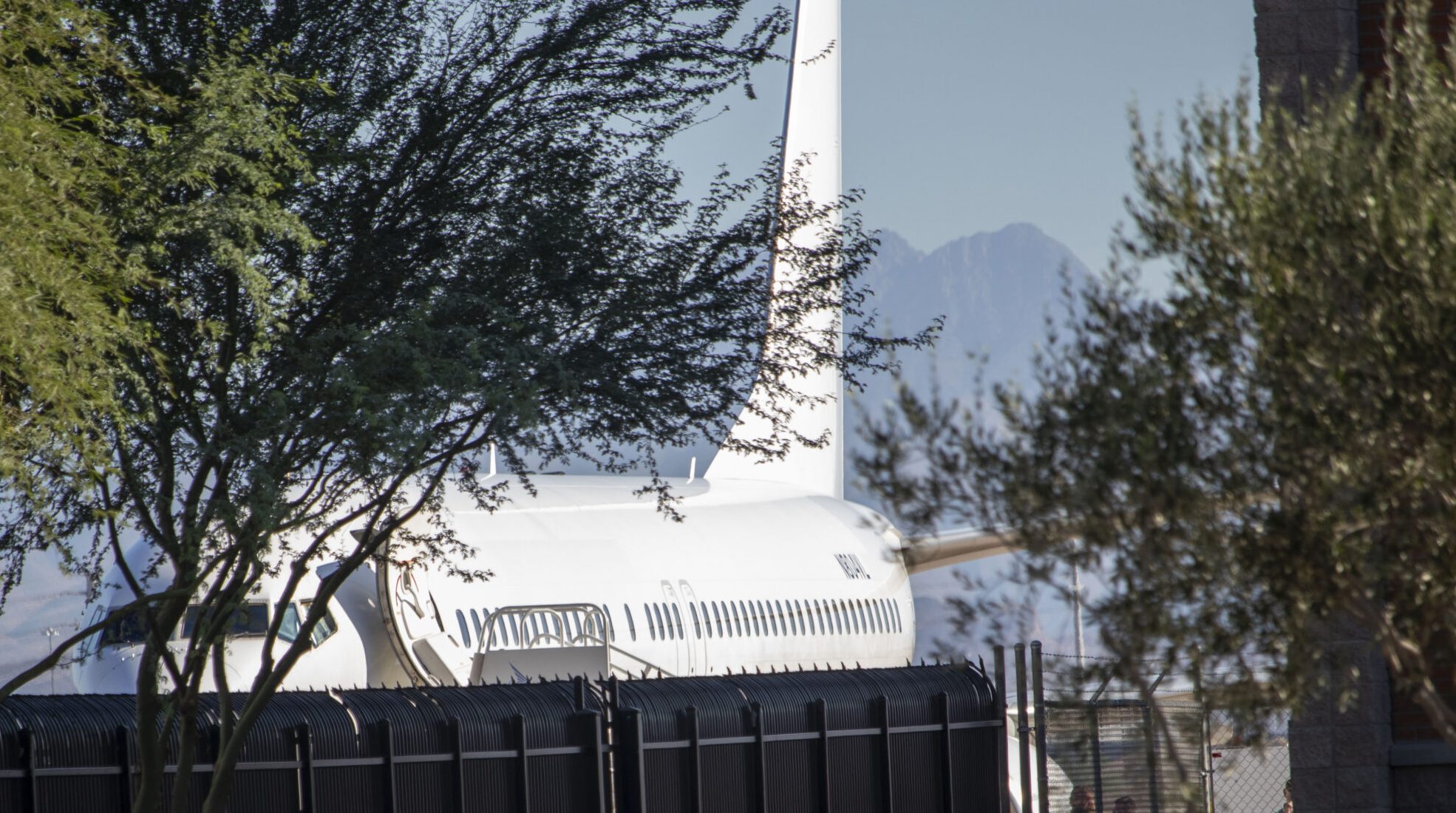 Bullet from Mesa police shootout hits ICE deportation plane